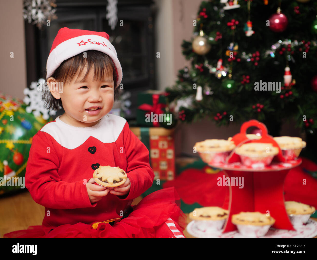 Happy santa baby girl Stock Photo - Alamy