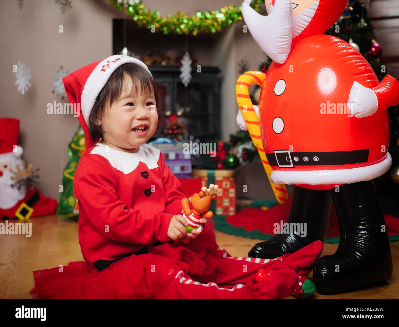 Happy santa baby girl Stock Photo - Alamy