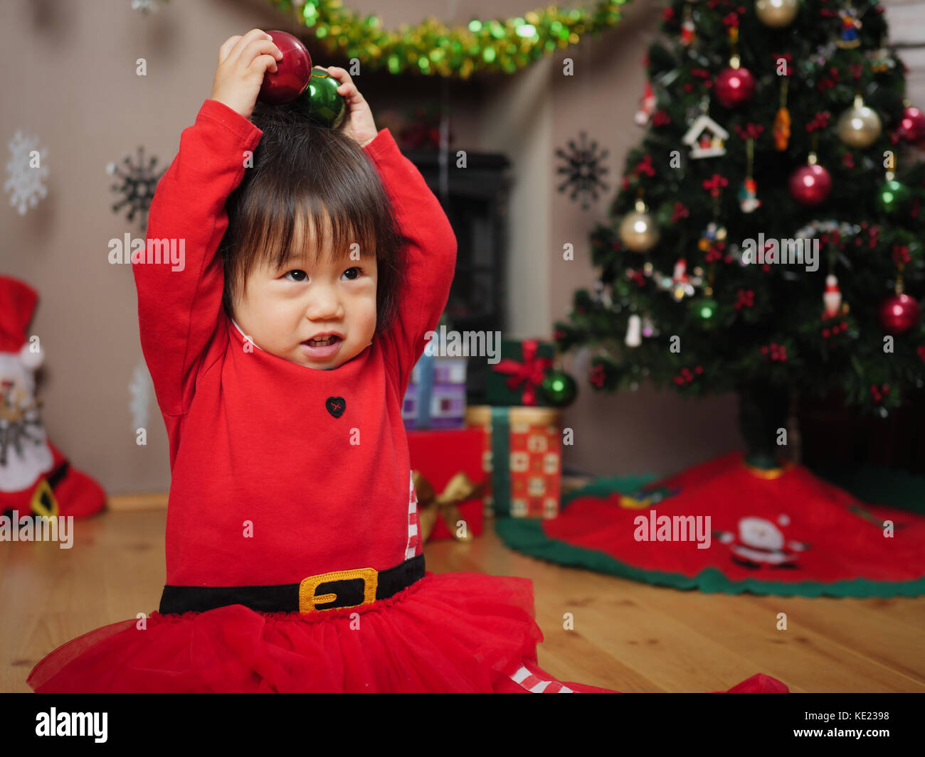 Happy santa baby girl Stock Photo - Alamy