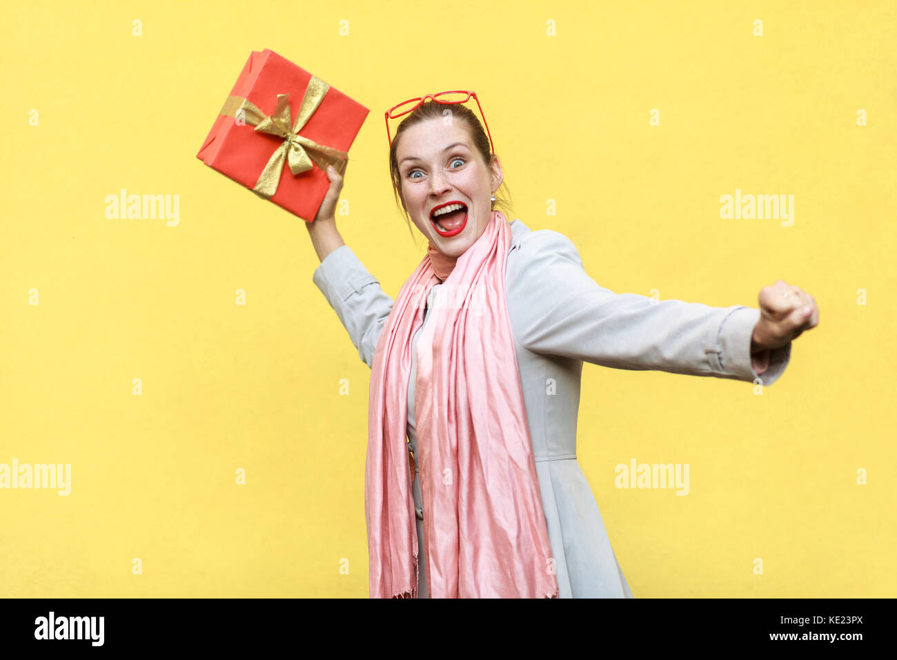 Catch your gift! Young adult crazy woman swung and wants to throw off ...