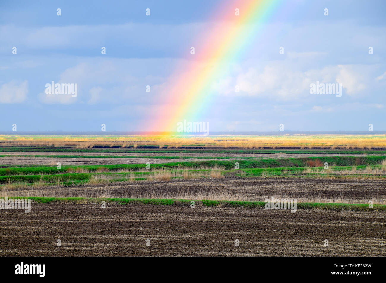 Rainbow, a view of the landscape in the field. Formation of the rainbow ...