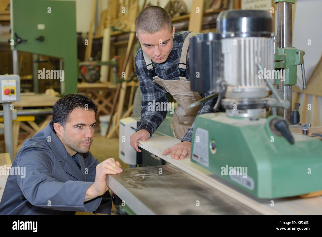 Two men working wood machinery hi-res stock photography and images - Alamy