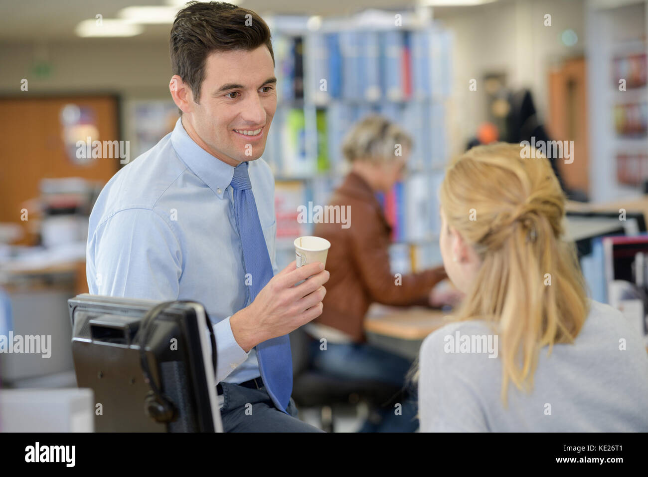 office staffs socializing Stock Photo - Alamy