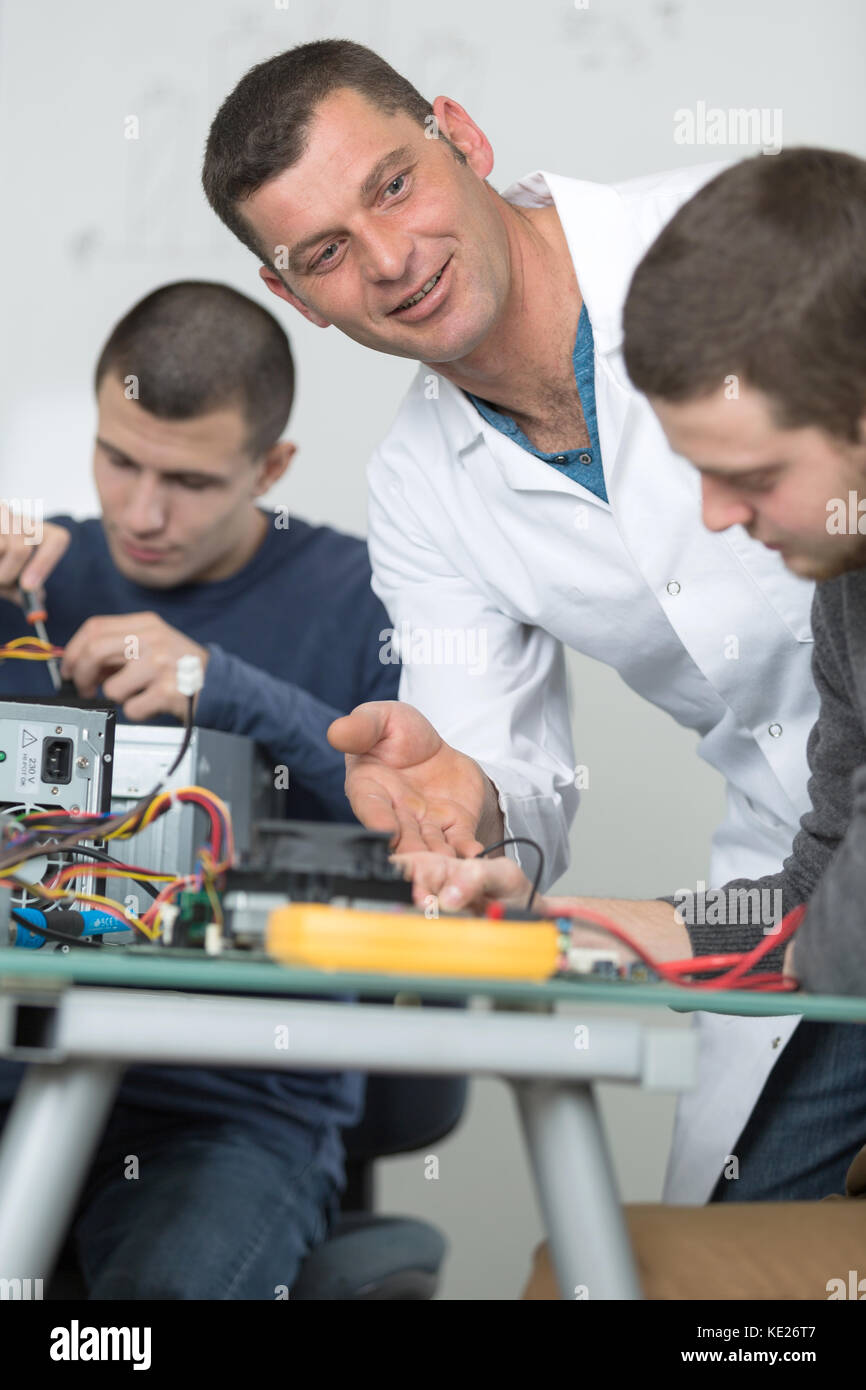 electrical technician fixing computer hard-drive Stock Photo - Alamy