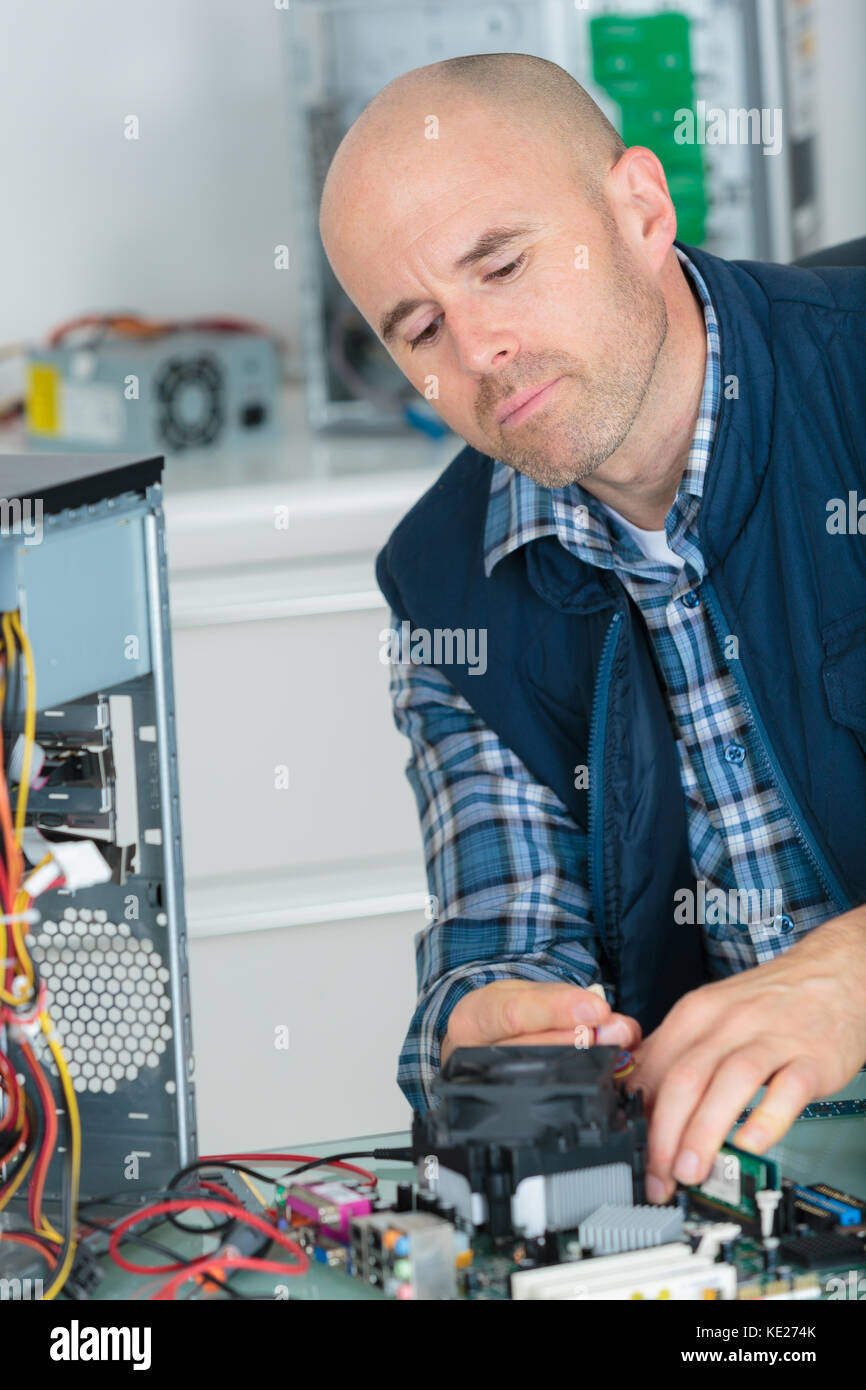 Man repairing computer Stock Photo - Alamy