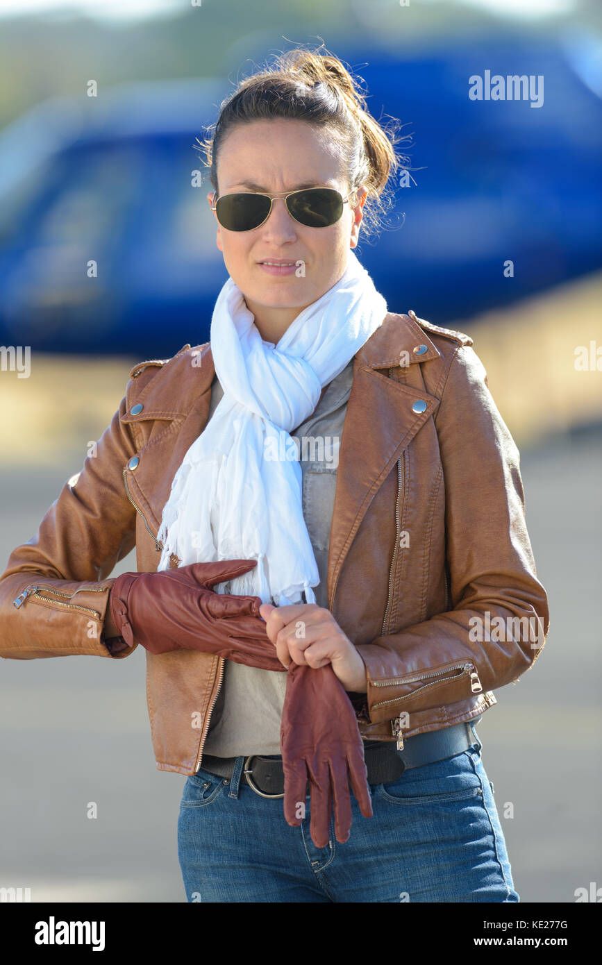 pilot woman on helicopter background Stock Photo - Alamy