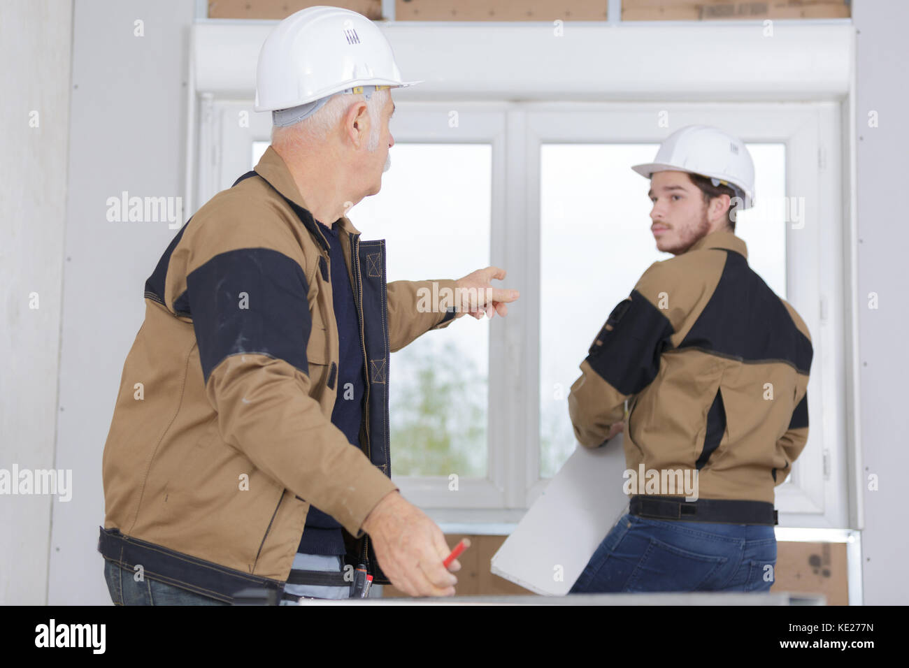 window builder working on mount of new installation Stock Photo - Alamy