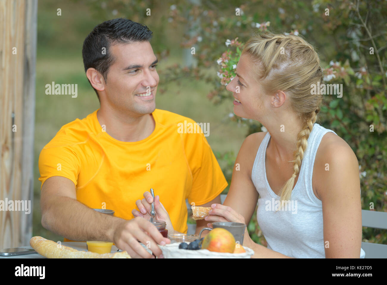 young couple having breakfast outside Stock Photo - Alamy