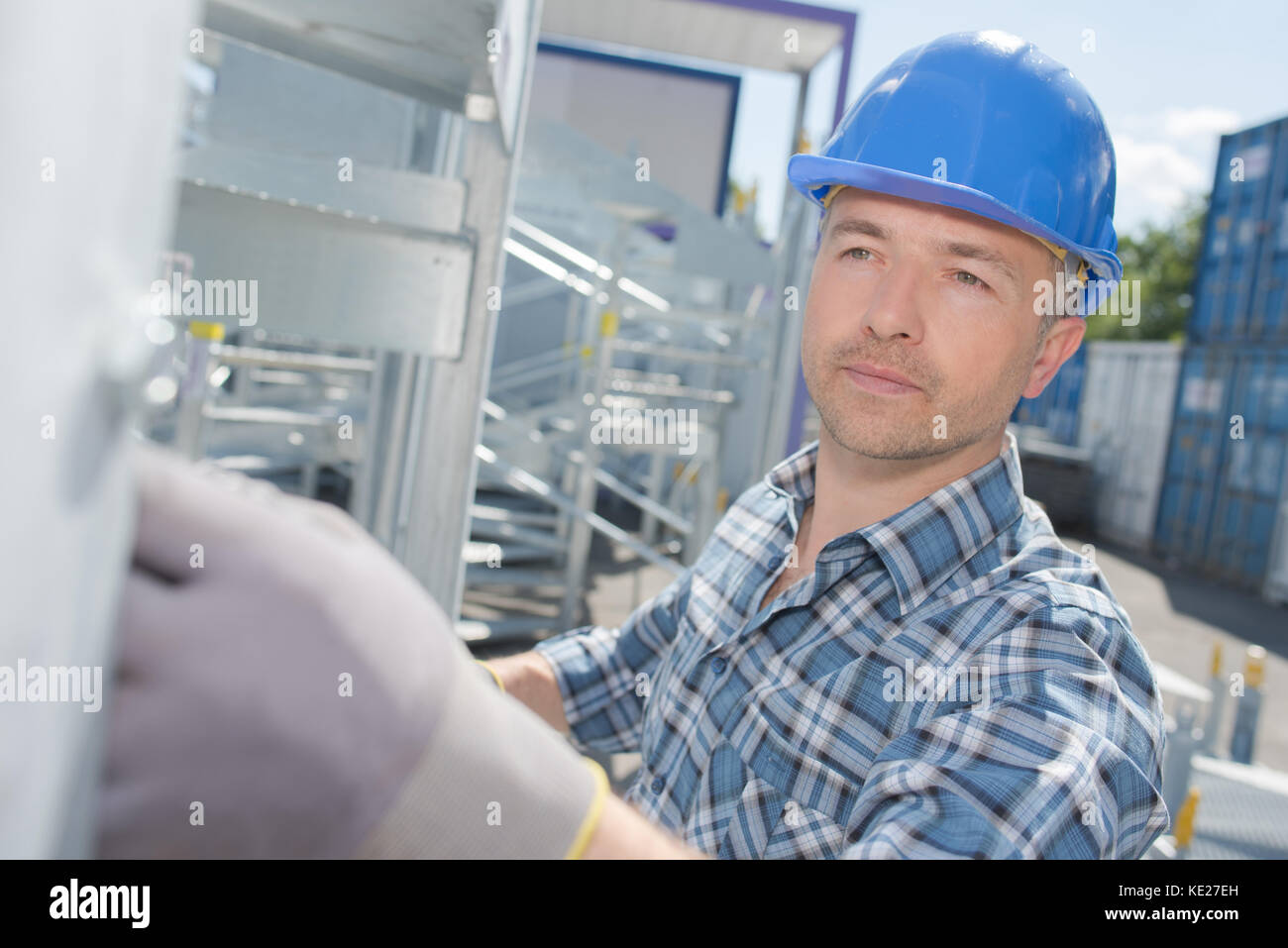 Man working on construction site Stock Photo - Alamy