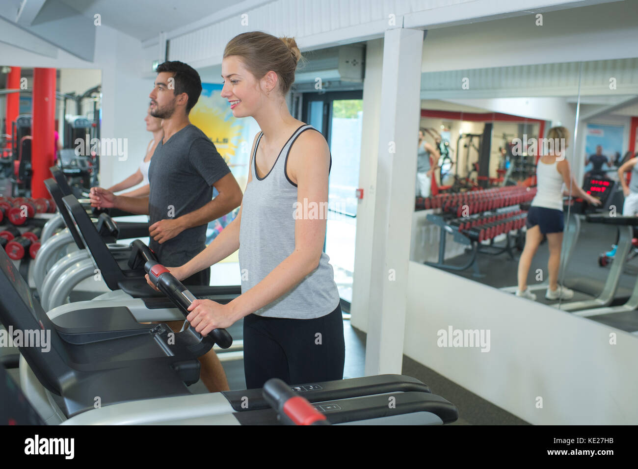 people walking in machine treadmill at fitness gym club Stock Photo - Alamy