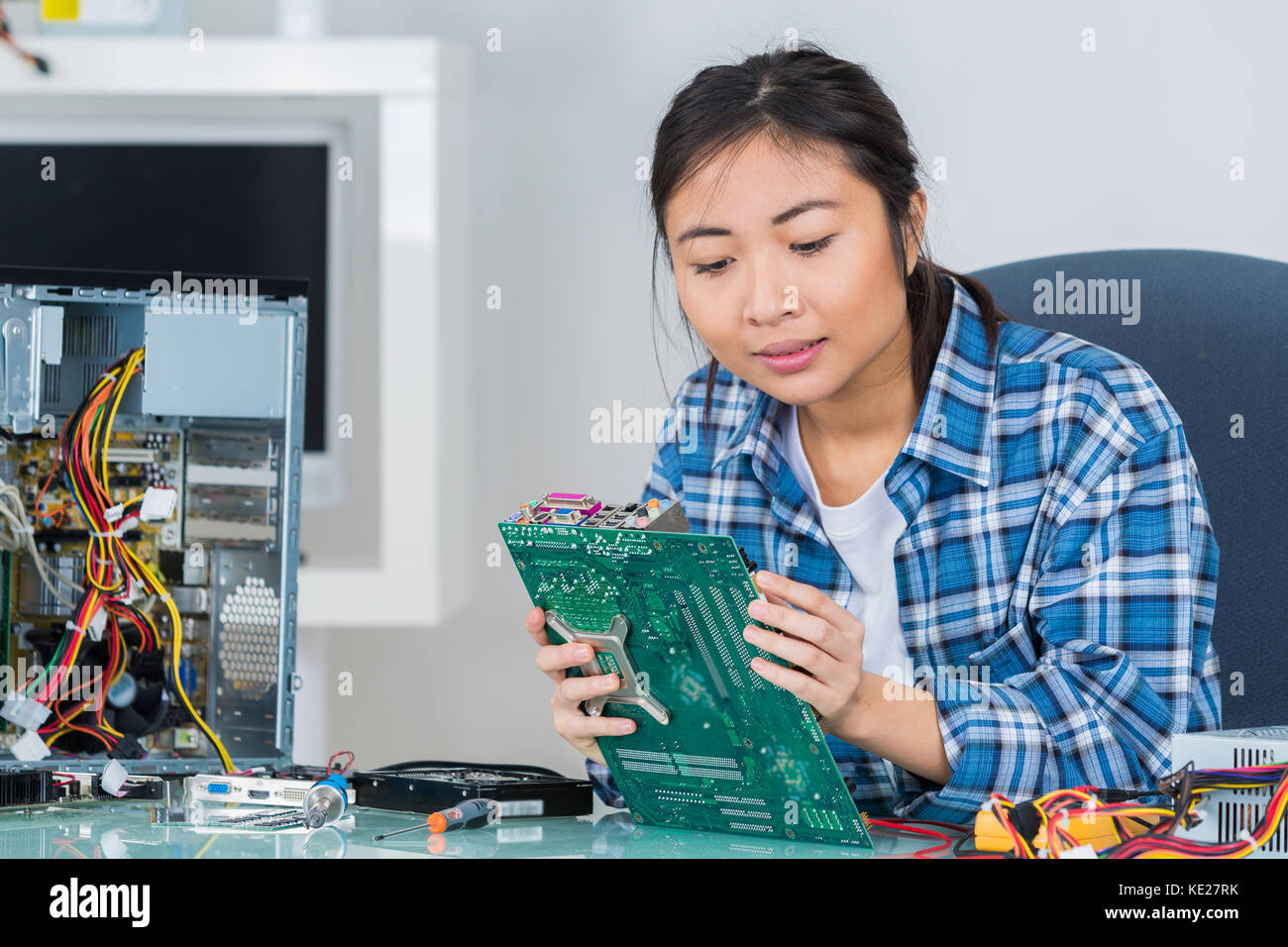 female technician working with transistor Stock Photo - Alamy