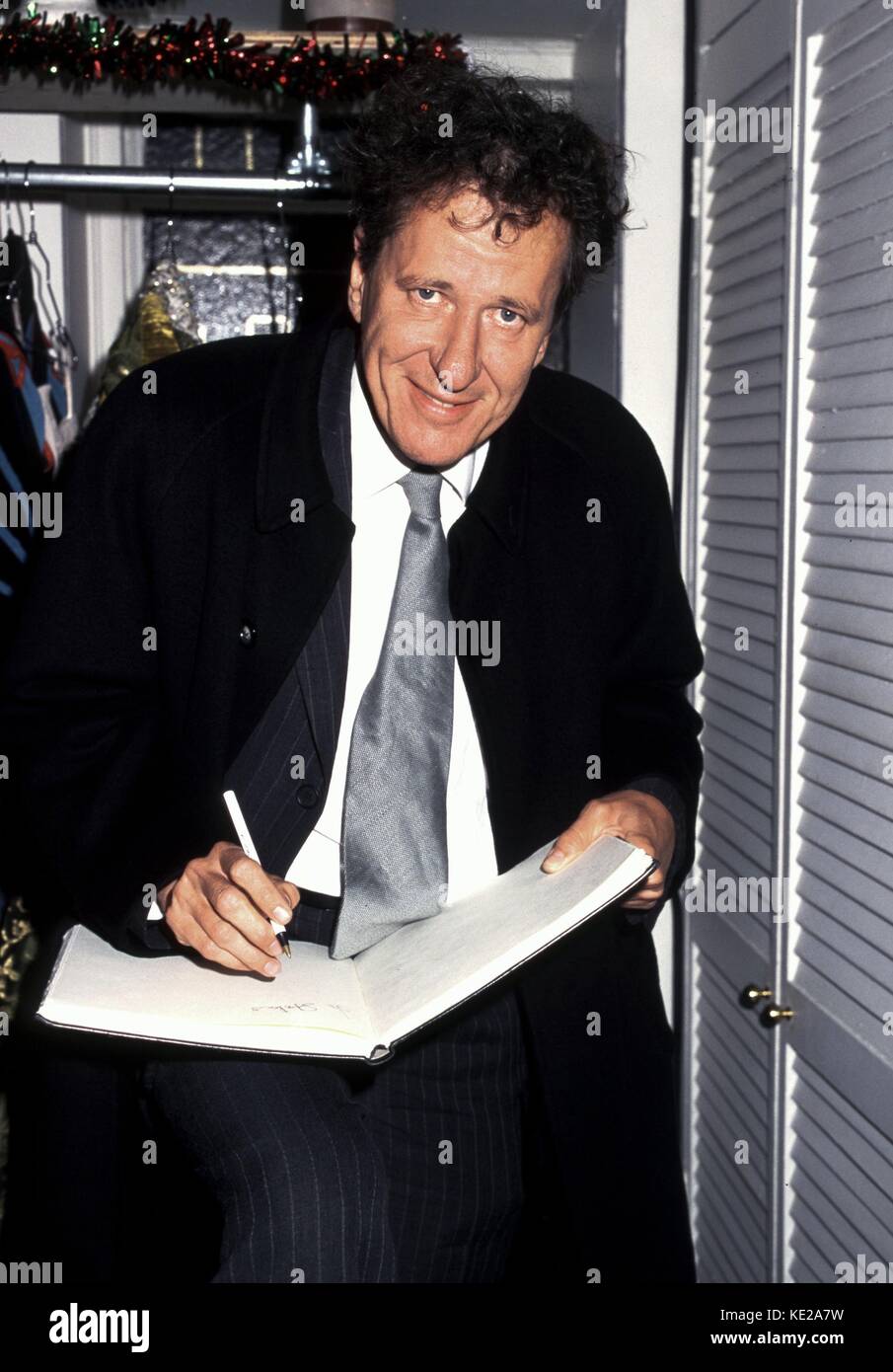 Geoffrey Rush signing autographs , while he visits the cast of "Kiss Me ...