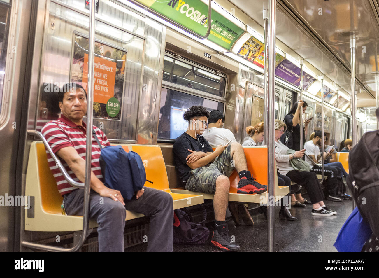 Passengers on New York City subway train Stock Photo - Alamy
