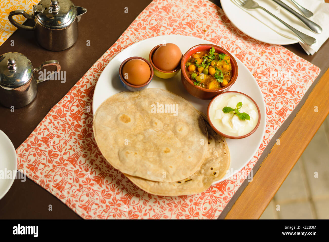 Traditional Nepali Indian breakfast with hard boiled eggs, prata bread ...
