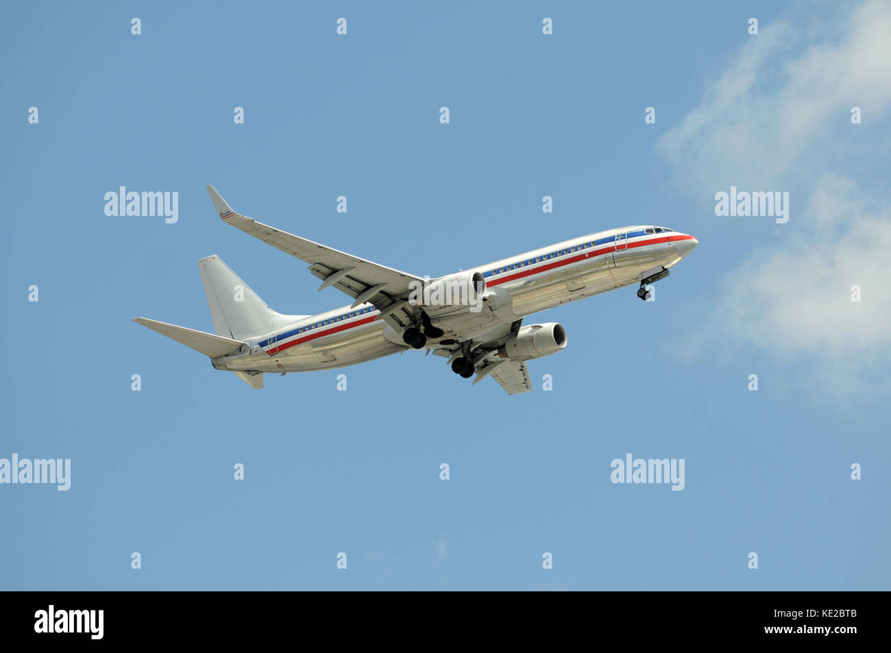 Modern jet airplane in silver color taking off Stock Photo - Alamy