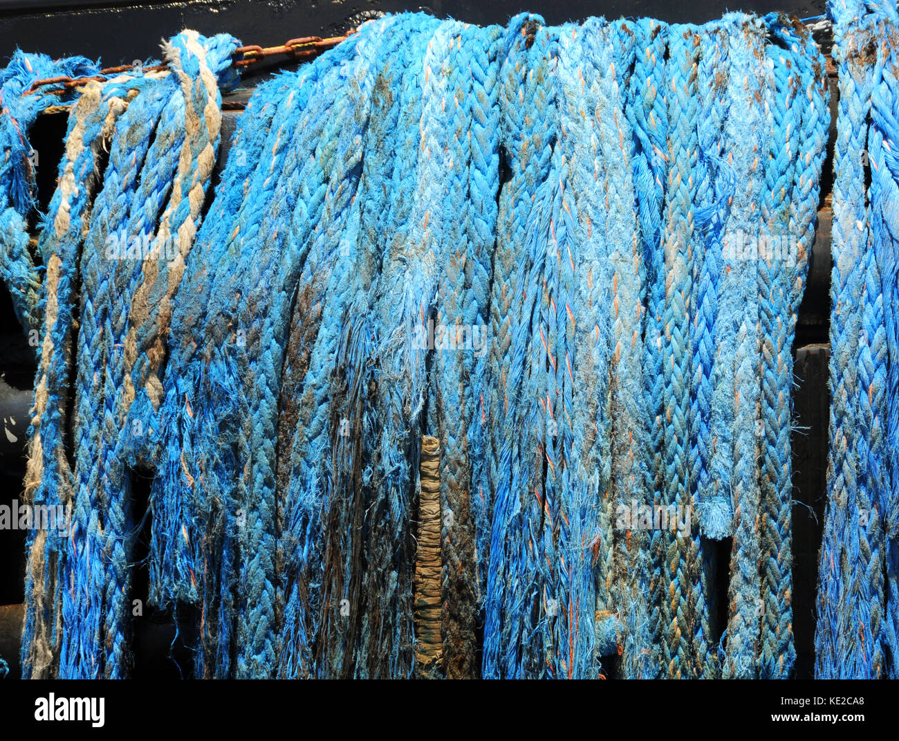 Faded blue ropes from old fishing boat Stock Photo - Alamy
