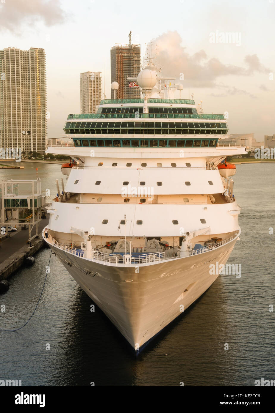 Modern ocean liner entering port in early morning Stock Photo - Alamy