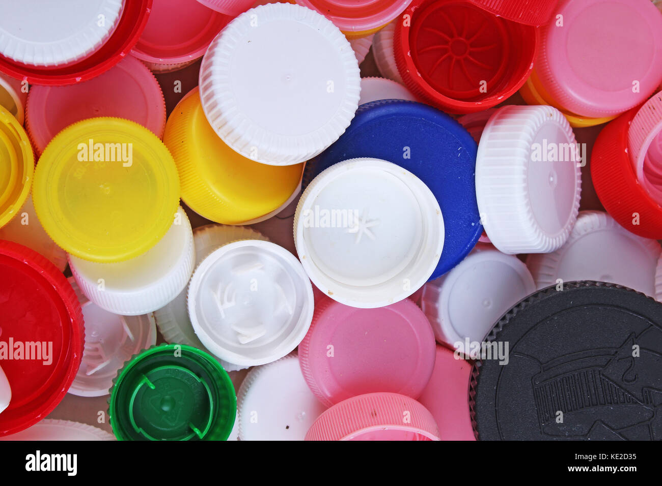 Plastic bottle caps. Close-up shot of stack of recyclable plastic ...