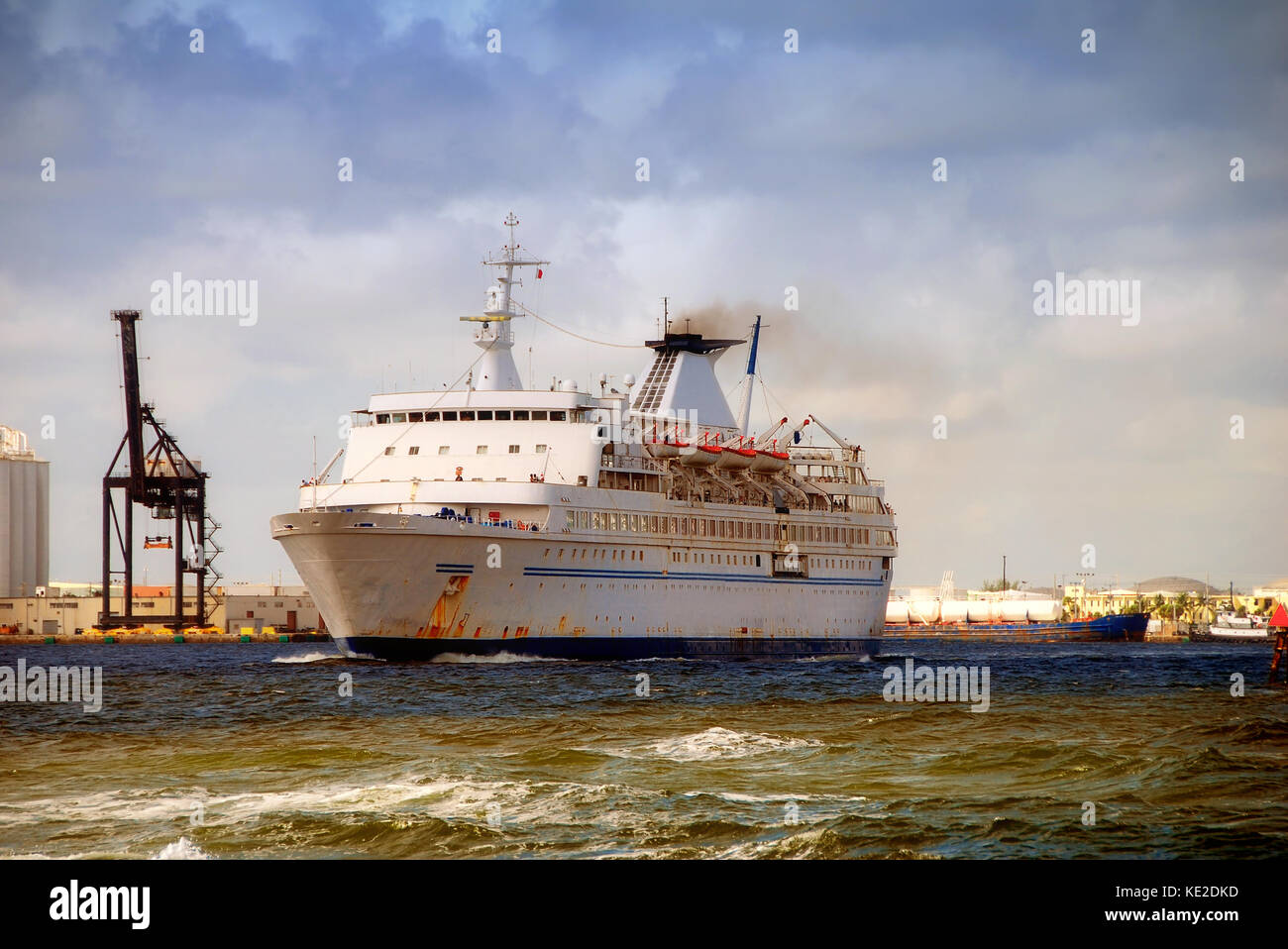 Passenger ship leaving port Stock Photo - Alamy