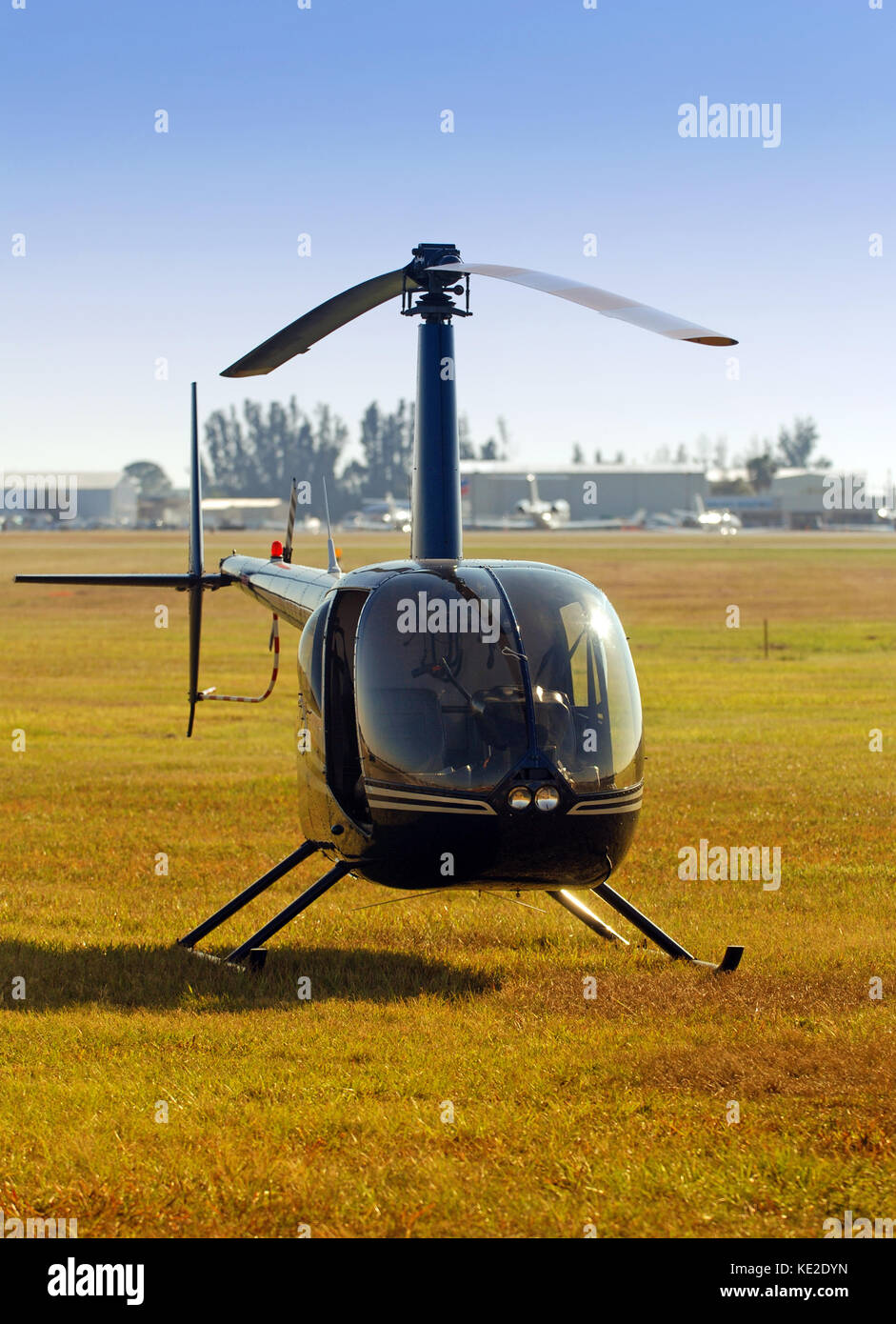 Helicopter in a field Stock Photo - Alamy