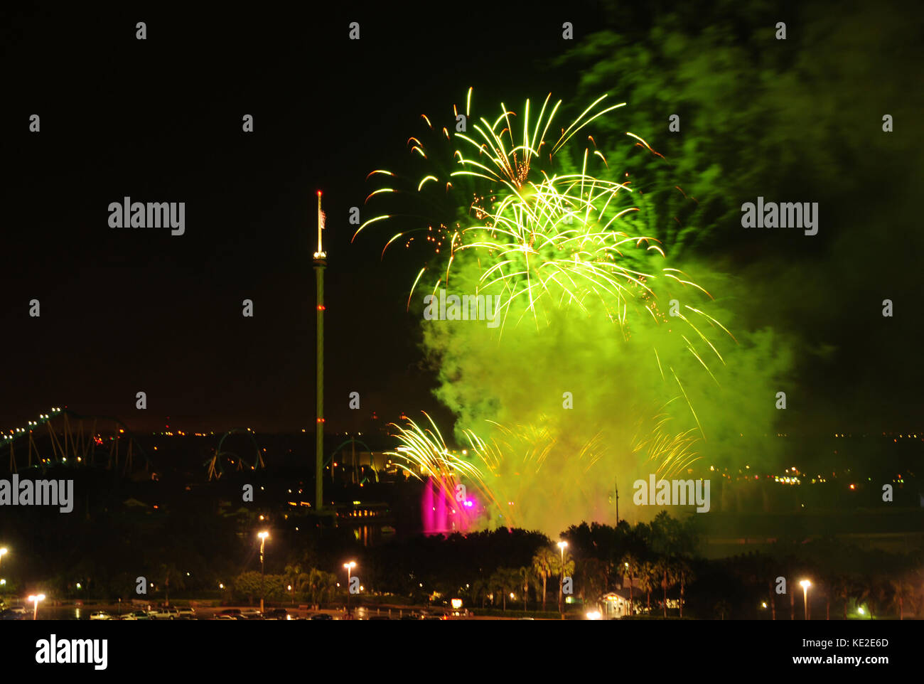 Outdoors fireworks exploding in green color Stock Photo - Alamy