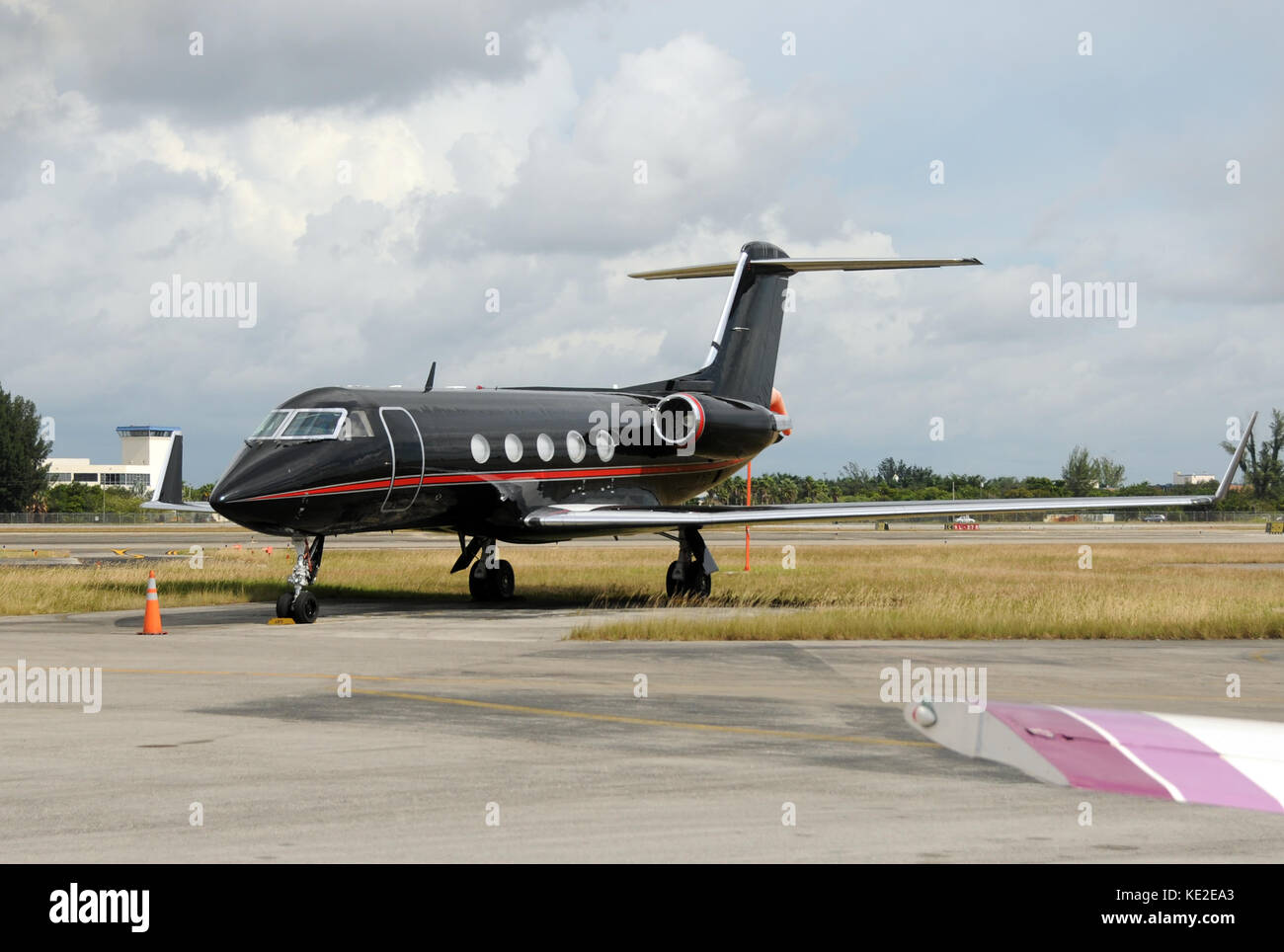 Luxury private jet painted black color Stock Photo - Alamy