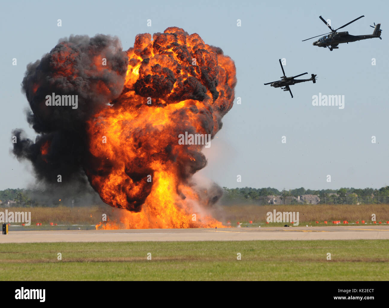 Two military helicopter attacking target on the ground Stock Photo - Alamy