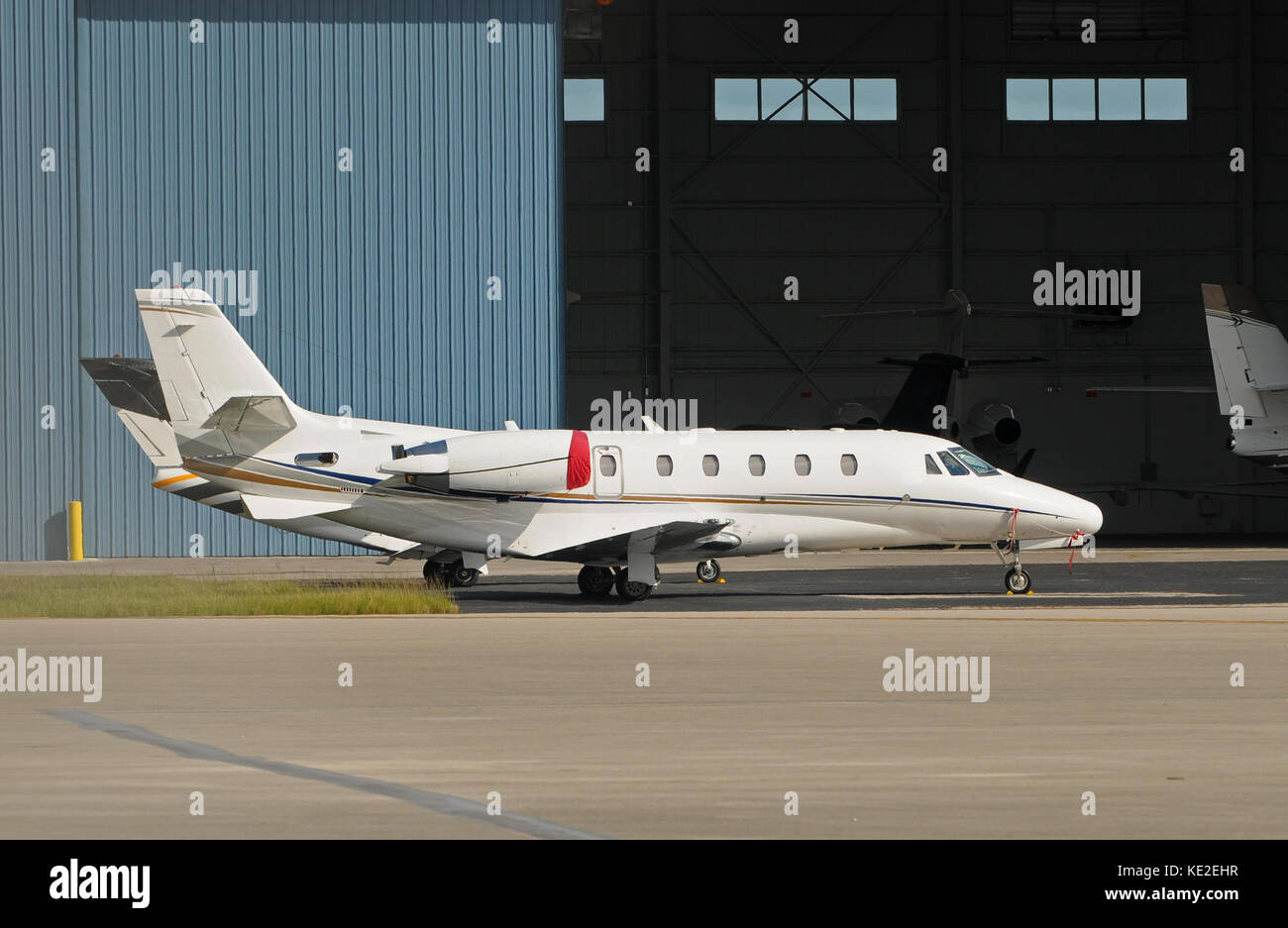 Luxury private jet in front of hangar Stock Photo - Alamy