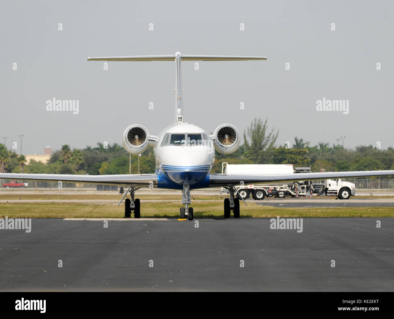 Luxury private jet on the ground front view Stock Photo - Alamy