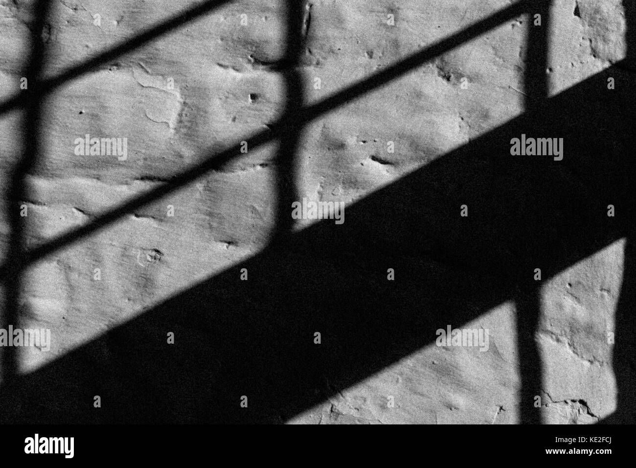 Angled shadows of a railing onto a white wall Stock Photo - Alamy