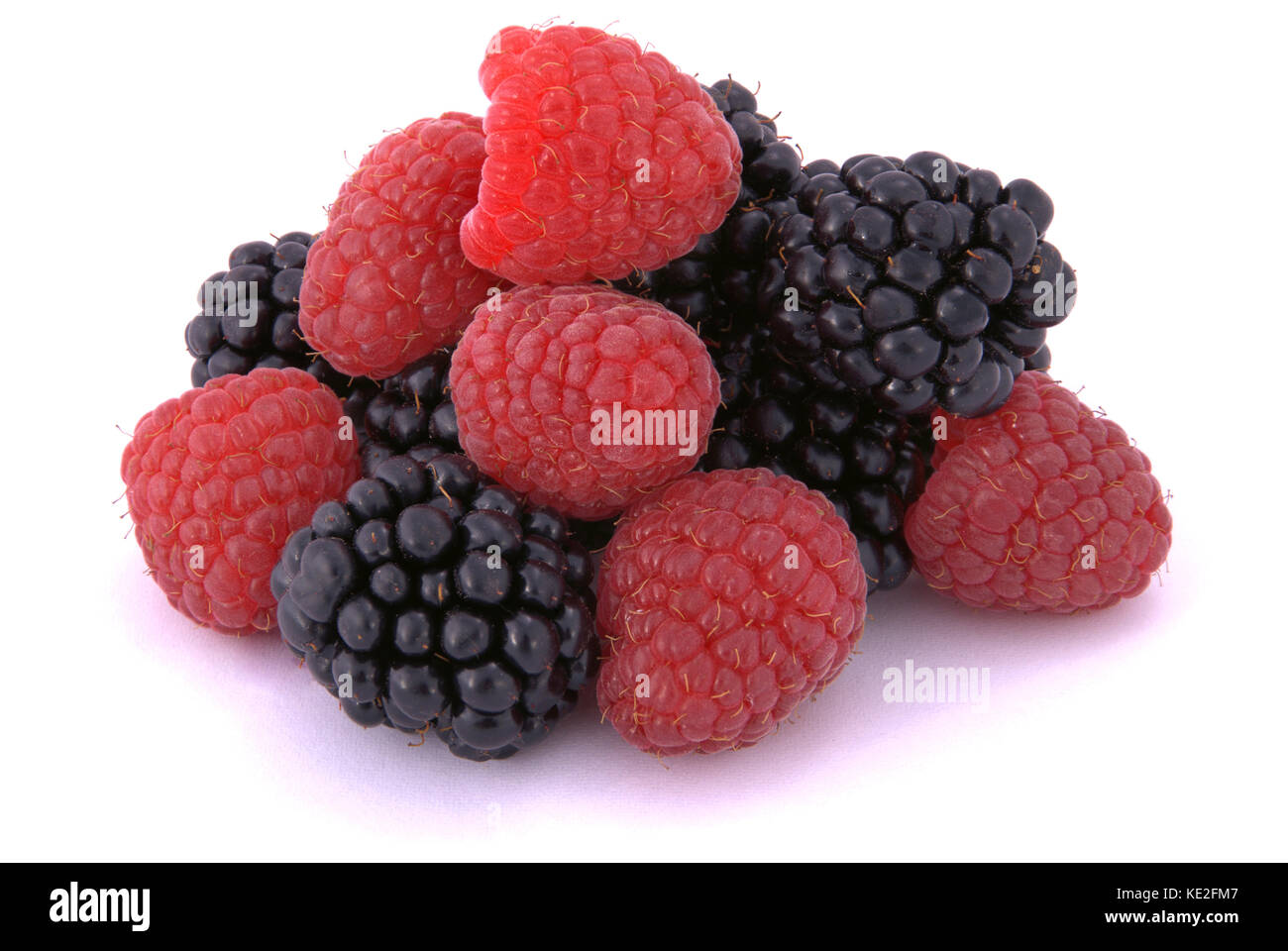 Raspberries and blackberries on white background Stock Photo - Alamy