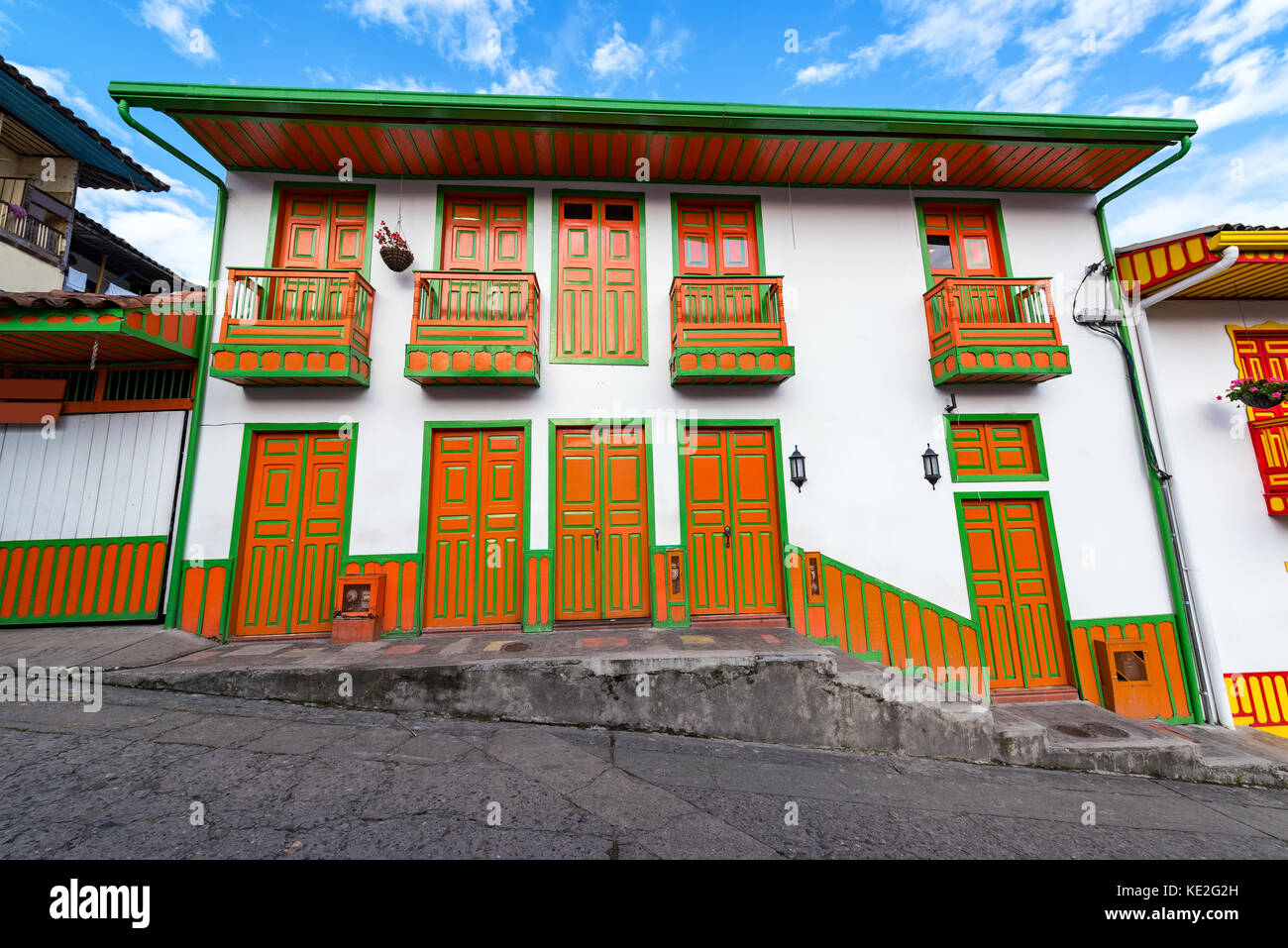 Orange and green colonial building in Salento, Colombia Stock Photo - Alamy