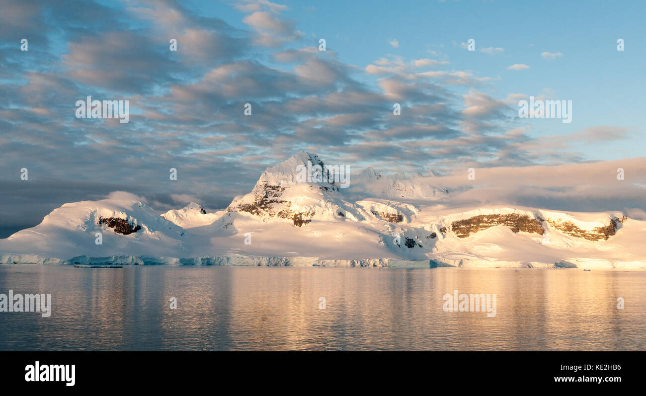Evening light on snow-capped mountains, Anvers Island, Antarctic ...