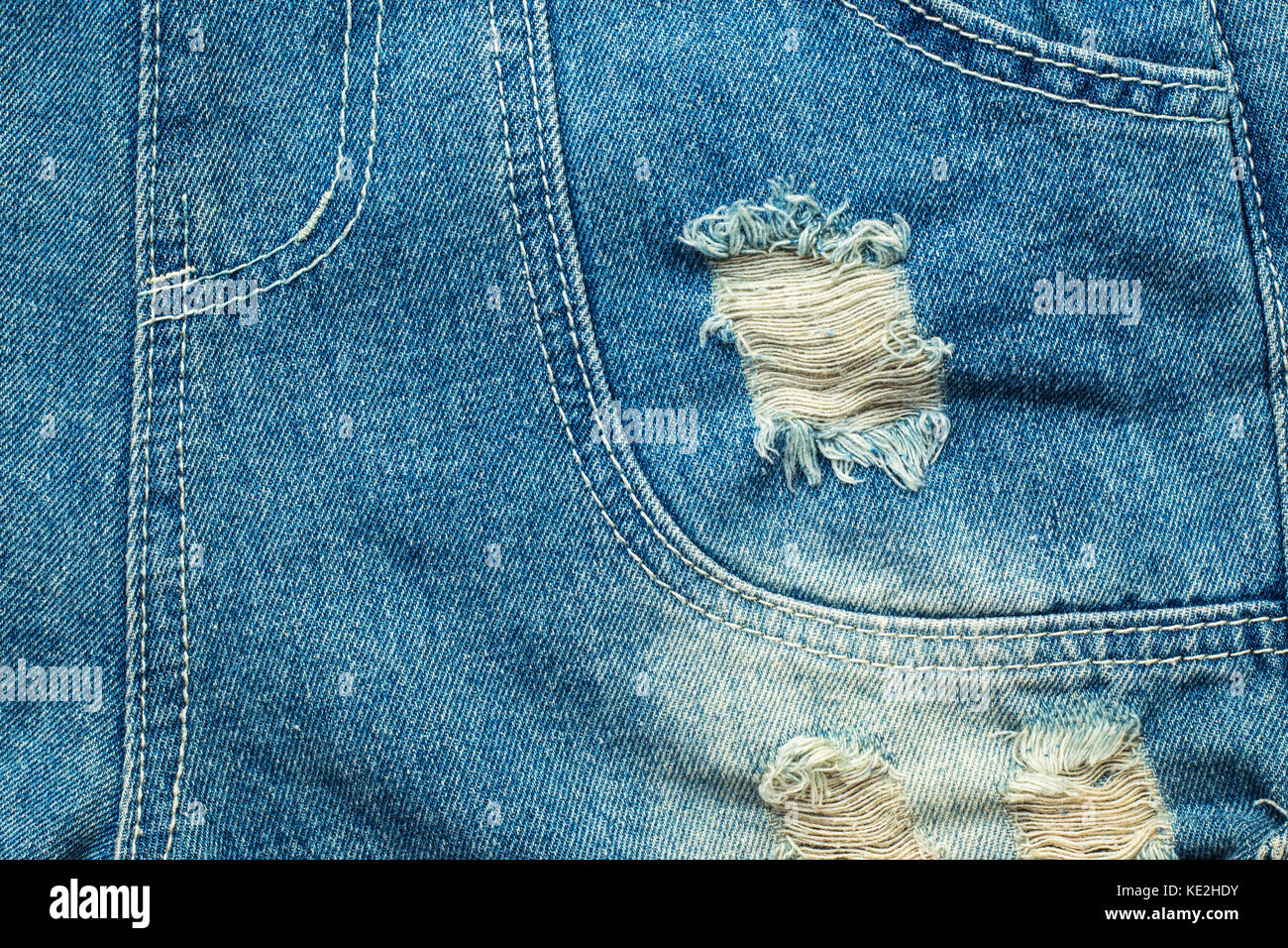 Rip denim jeans background with seam of jeans fashion design Stock ...