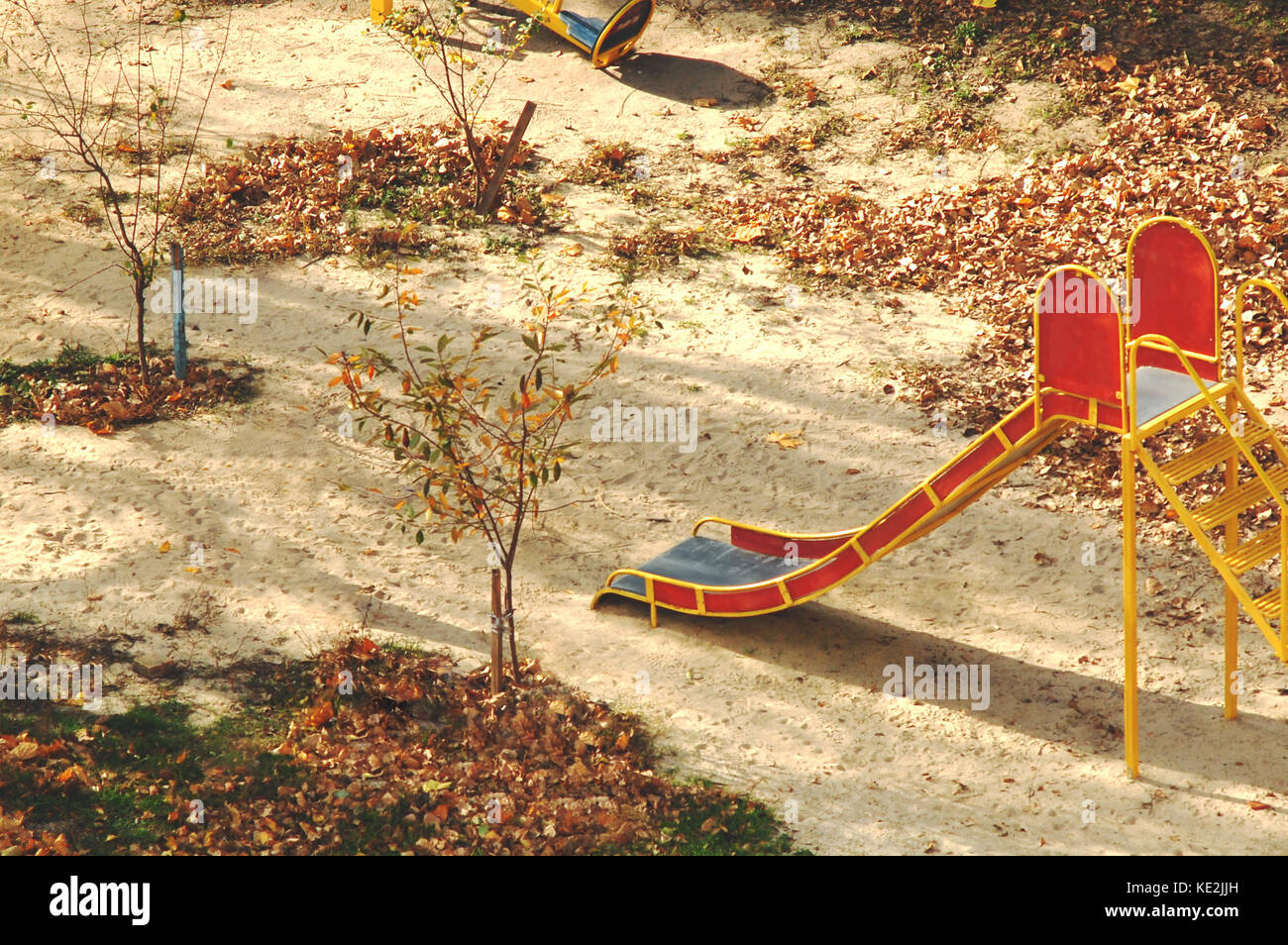 Children's slide at yard autumn playground. Top view Stock Photo - Alamy