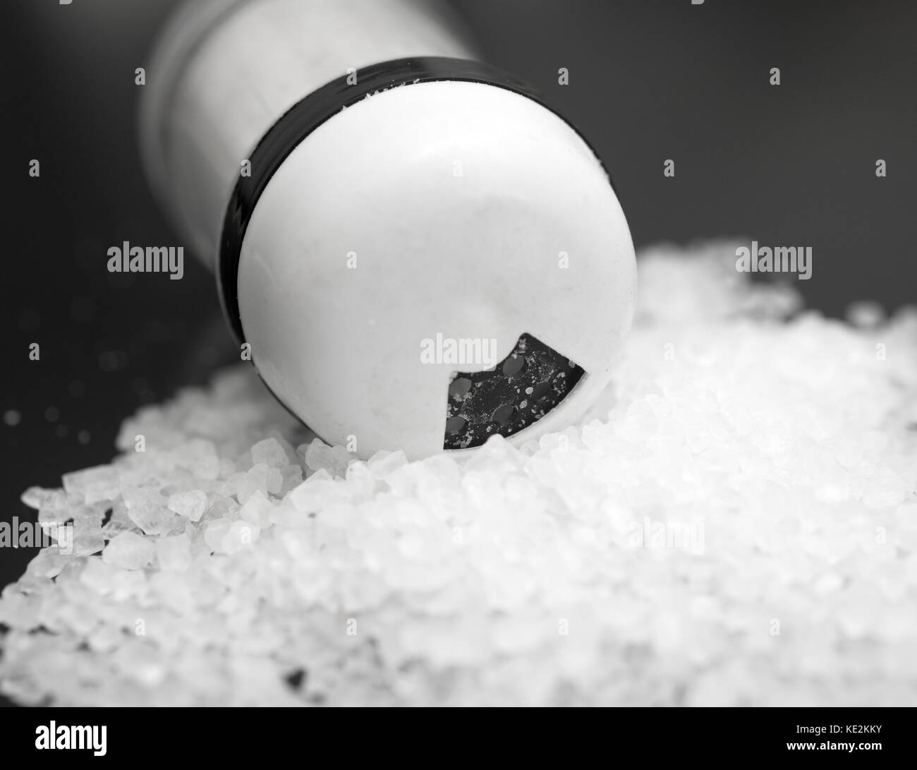 salt shaker on a black background Stock Photo - Alamy