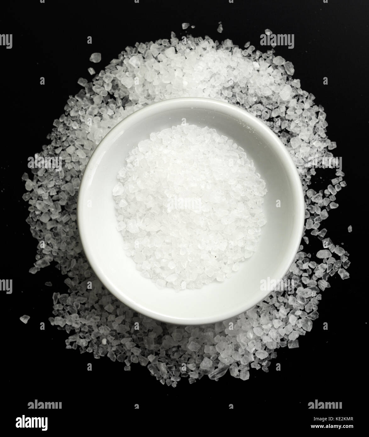 sea salt on a black background Stock Photo - Alamy