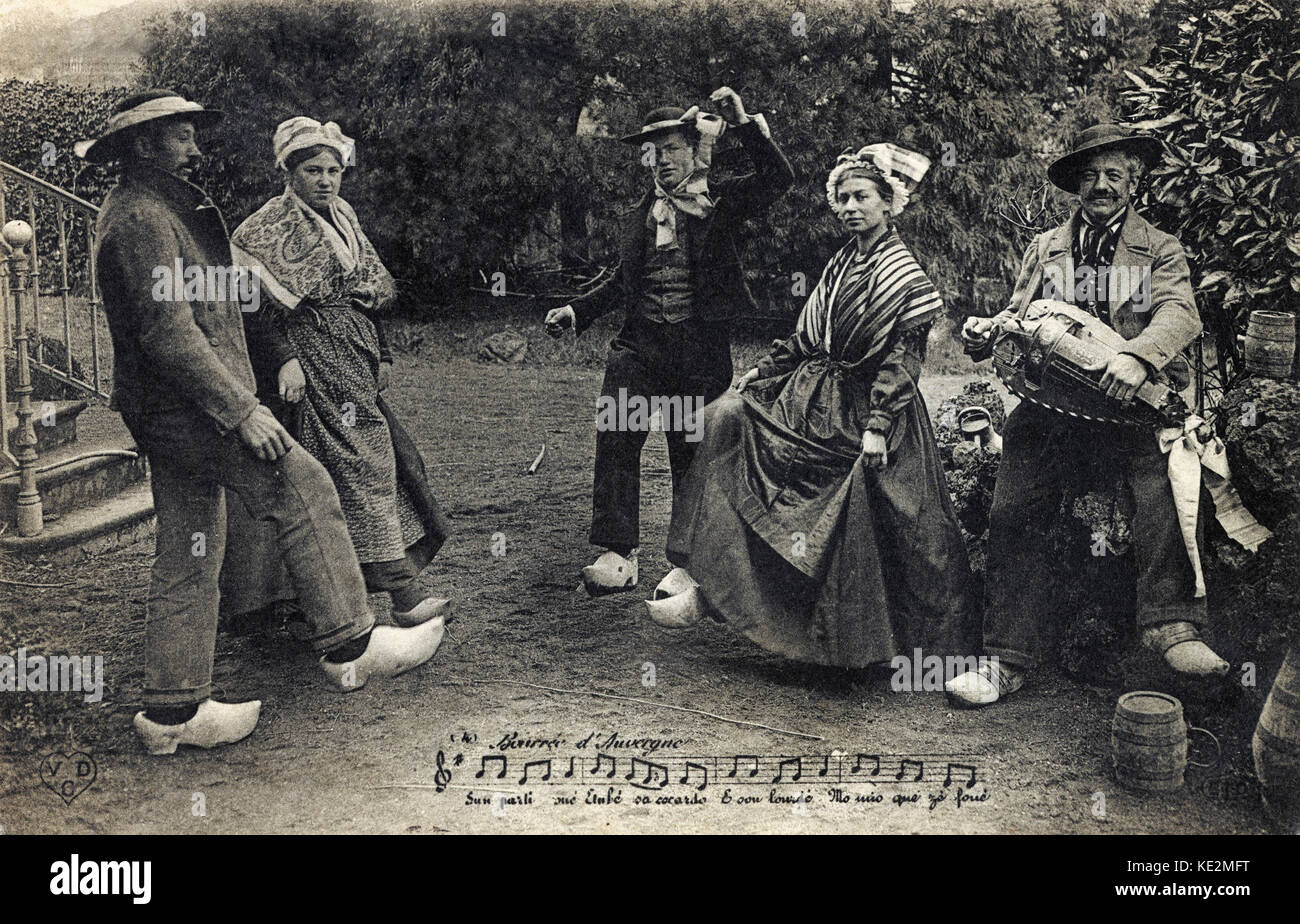 French folk dancing from the region of Auvergne. One man plays a hurdy ...