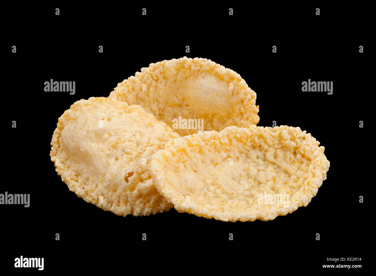 Corn flakes snack isolated on black background Stock Photo - Alamy
