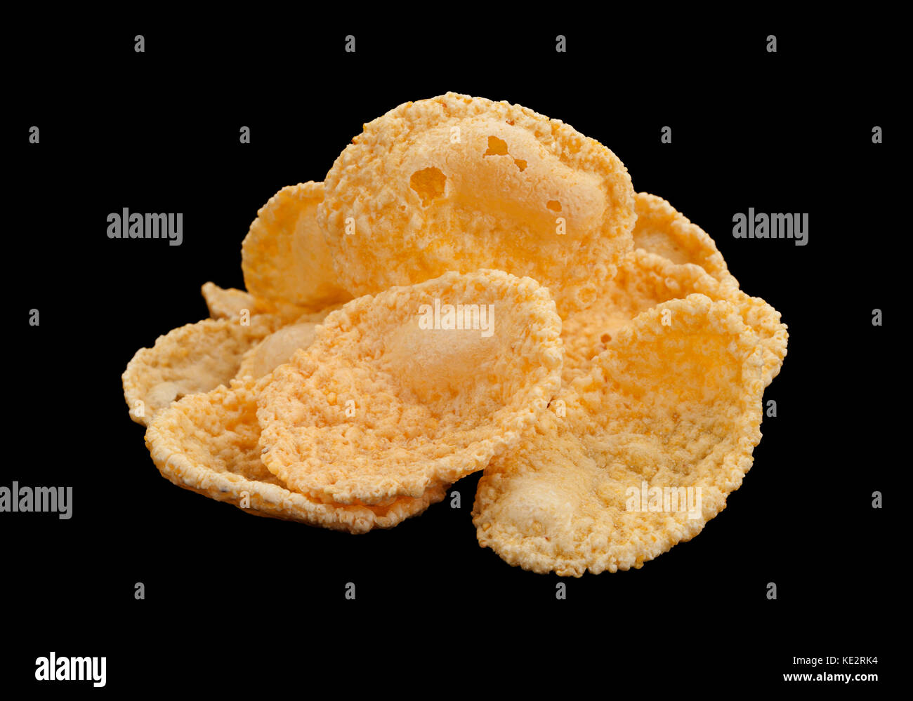 Corn flakes snack isolated on black background Stock Photo - Alamy