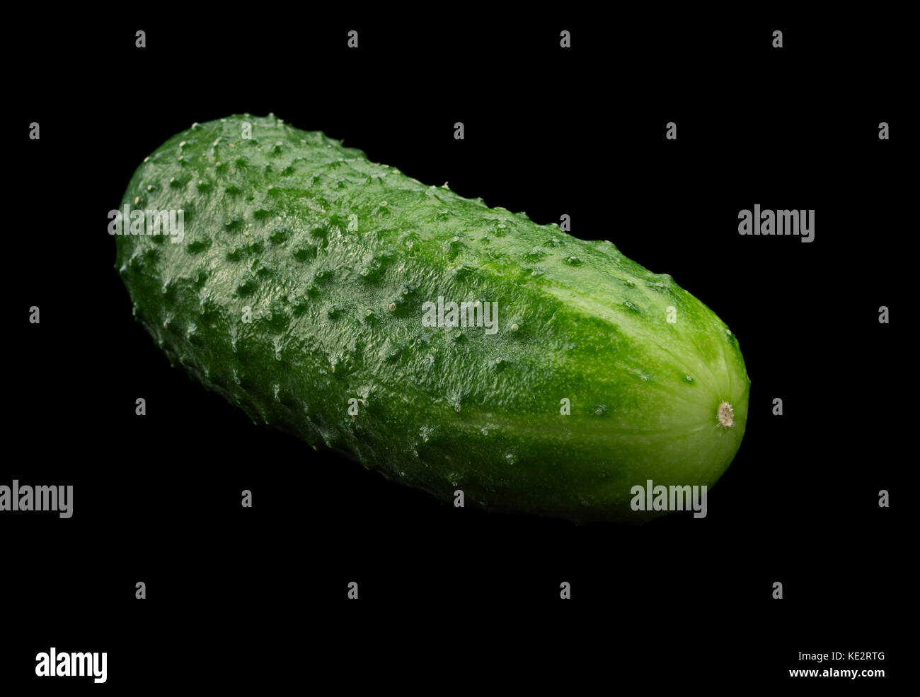 Cucumber vegetable isolated on black background Stock Photo - Alamy