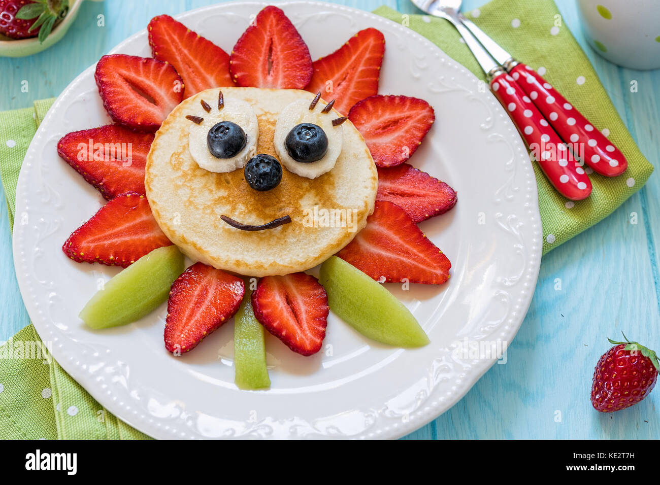 Funny Flower Pancake with berries for kids Stock Photo - Alamy
