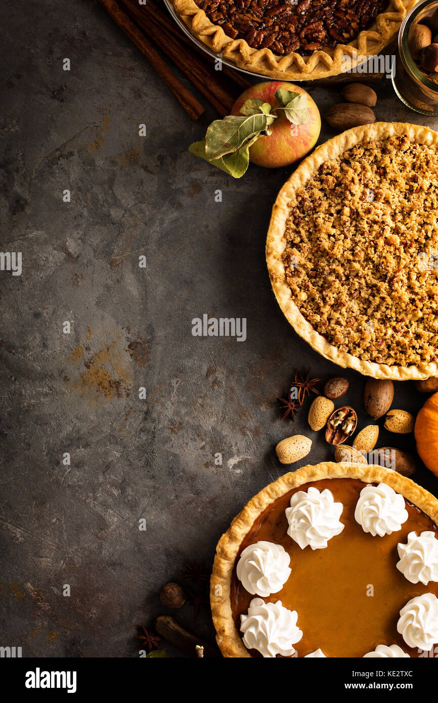 Fall traditional pies pumpkin, pecan and apple crumble pie overhead ...