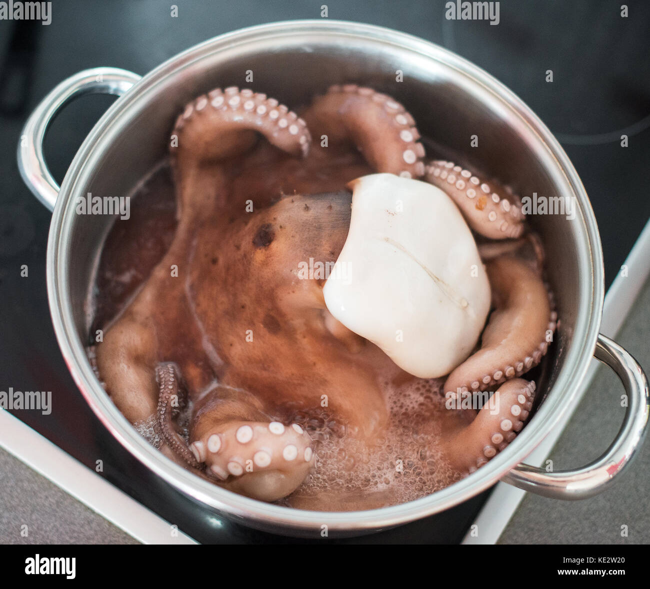Preparation of an octopus in a pan Stock Photo - Alamy