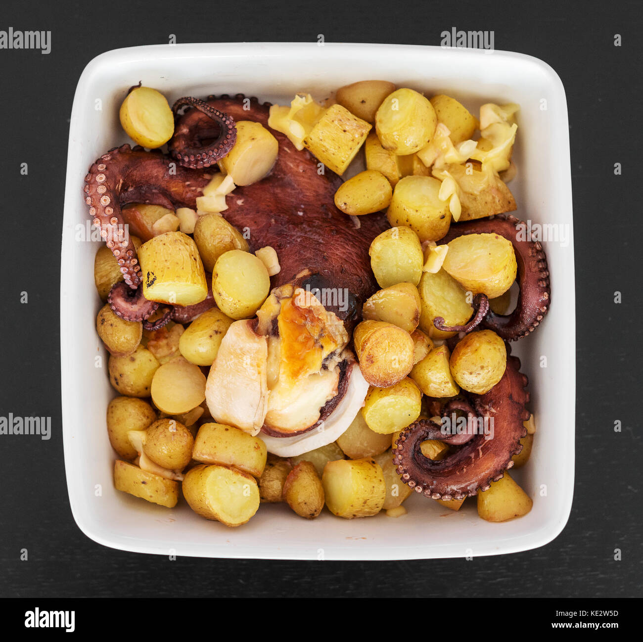 Plate with Baked Octopus with Potatoes Stock Photo - Alamy
