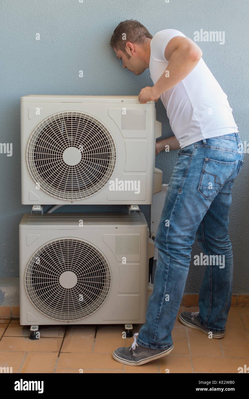 Installing electric equipment hi-res stock photography and images - Alamy