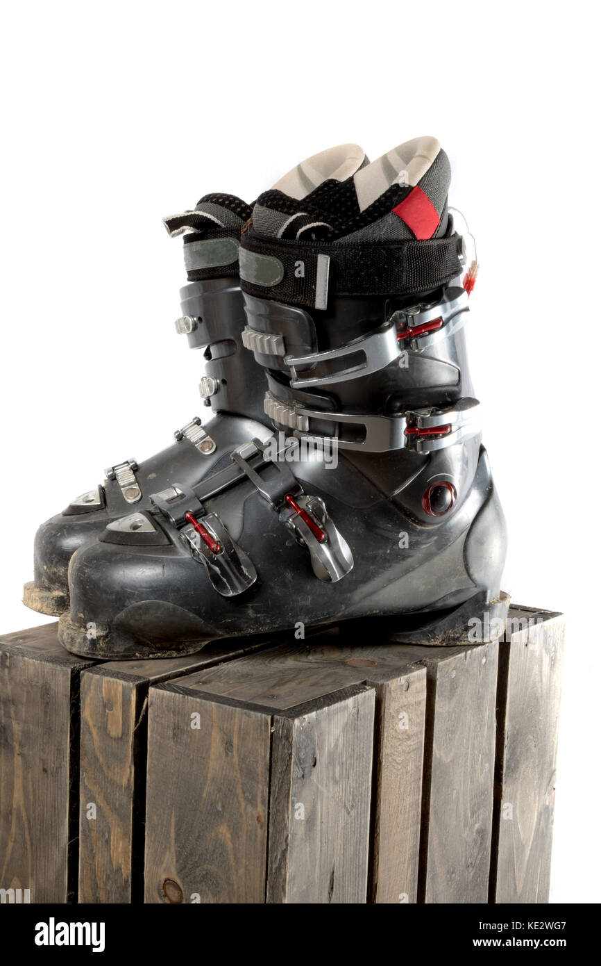 Ski boot sitting on a wooden crate isolated on a white background Stock ...