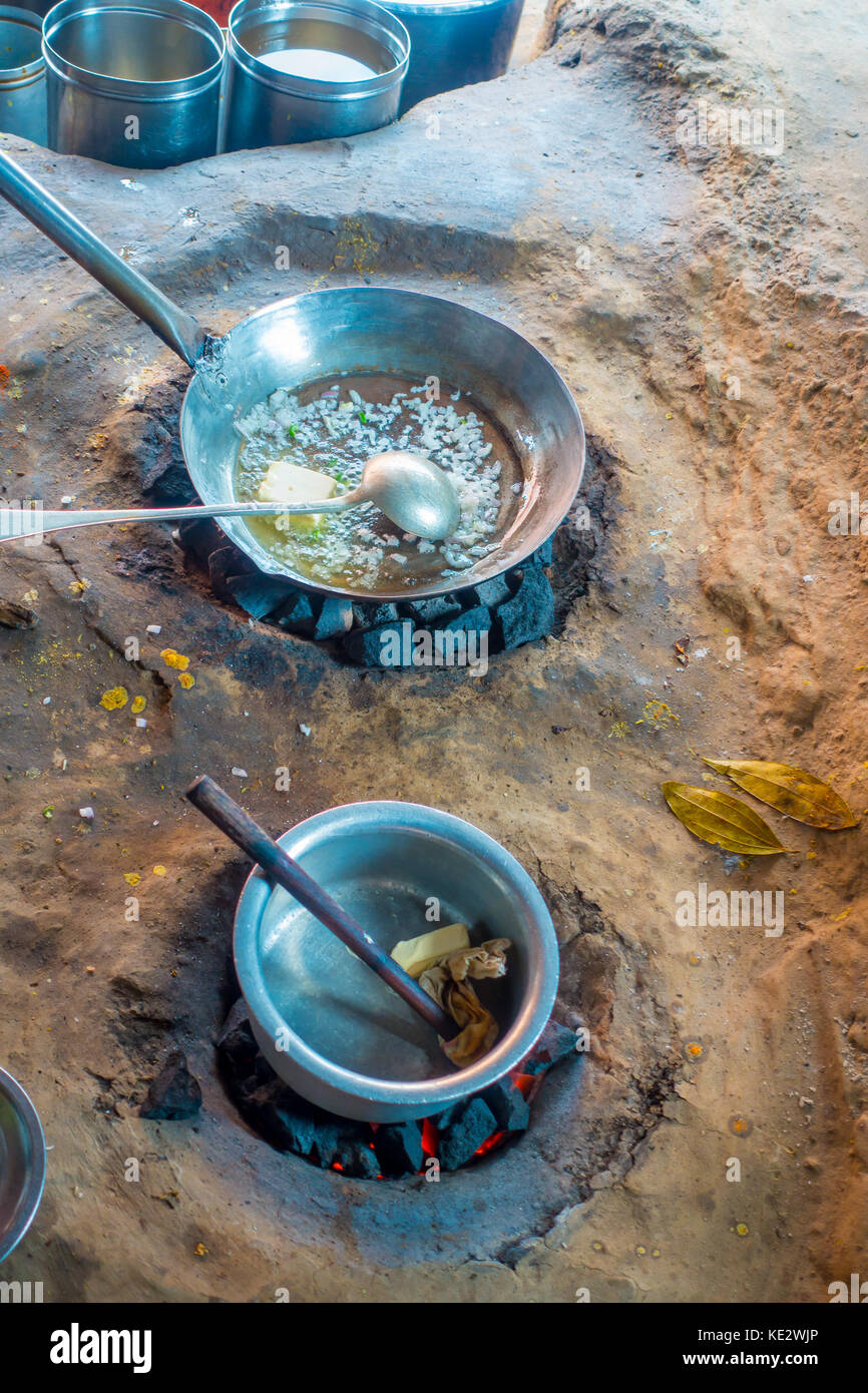 Close up of Indian food inside of a metallic trays in the ground, using ...