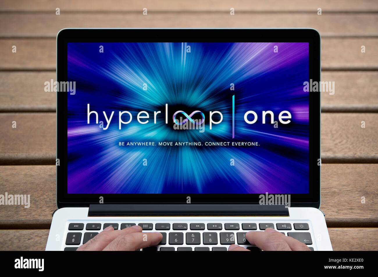 The Hyperloop One logo is shown on the screen of a MacBook Pro laptop ...