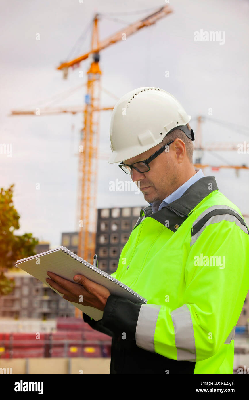 Construction engineer wearing safety vest Stock Photo - Alamy